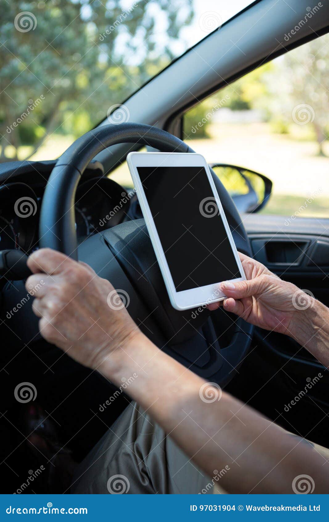 Senior Woman Using Digital Tablet while Driving a Car Stock Photo ...