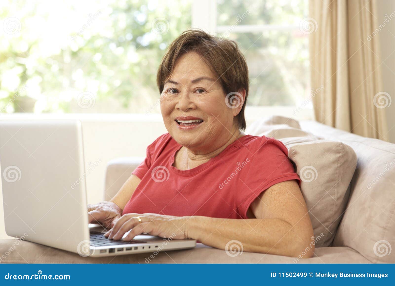 Senior Woman Using Laptop at Home Stock Image - Image of silver ...