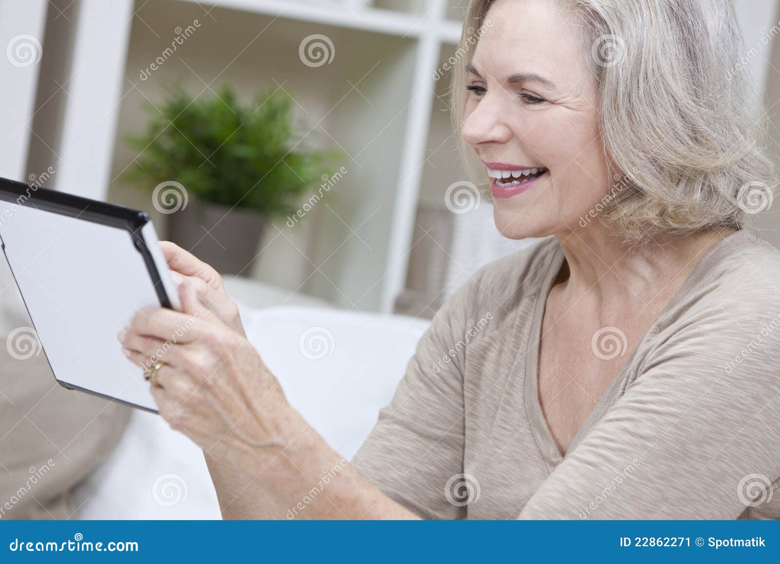 Senior Woman Using Tablet Computer Stock Image - Image of sitting ... Senior Woman Using Tablet Computer Stock Image - Image of sitting ...