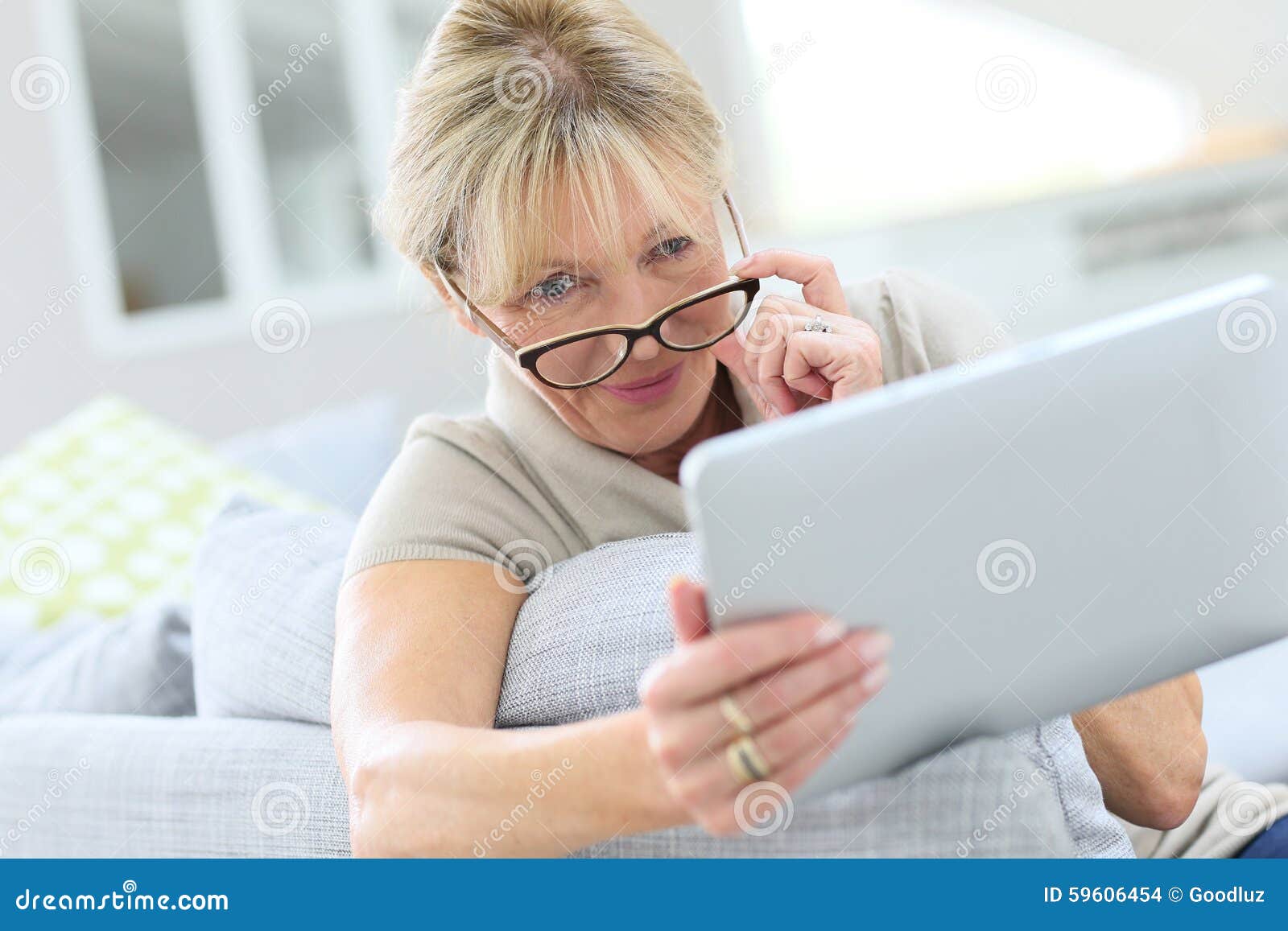 Senior woman using tablet stock photo. Image of technology - 59606454