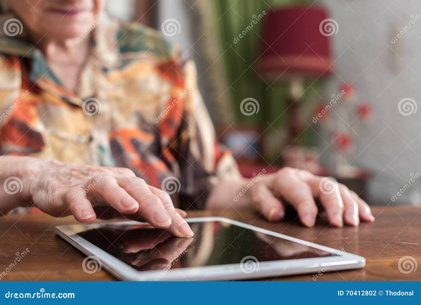 Senior woman using tablet stock photo. Image of grandmother - 70412802