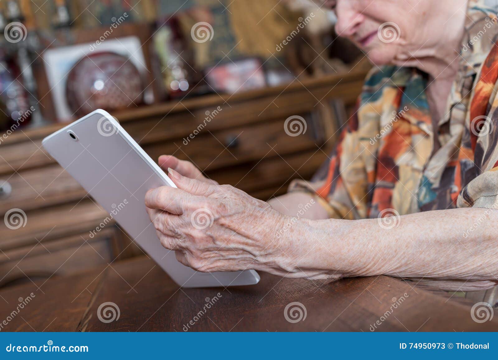 Senior woman using tablet stock image. Image of internet - 74950973