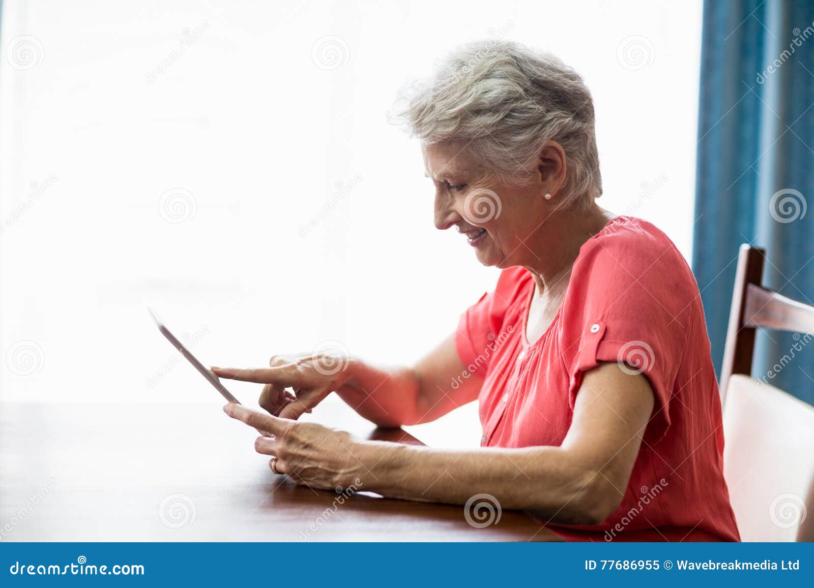 Senior Woman Using a Tablet Stock Image - Image of aged, senior: 77686955