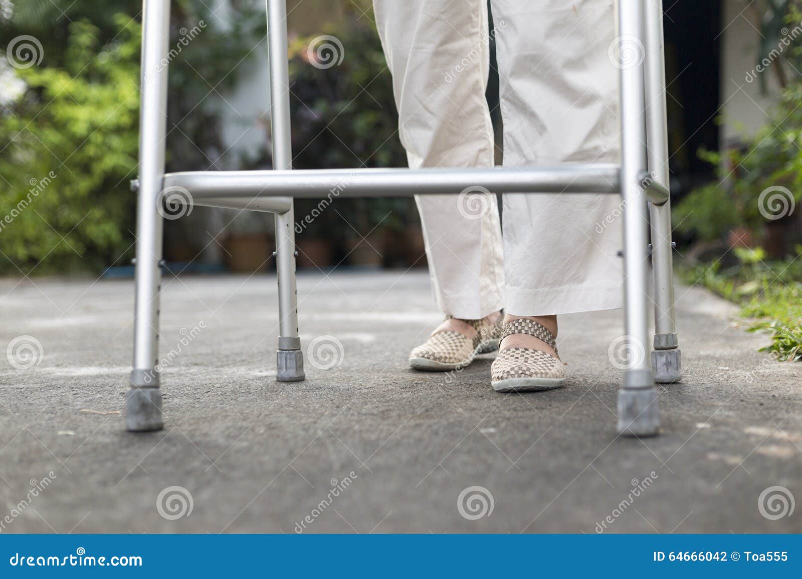 Senior Woman Using a Walker Stock Photo - Image of help, orthopedic ...