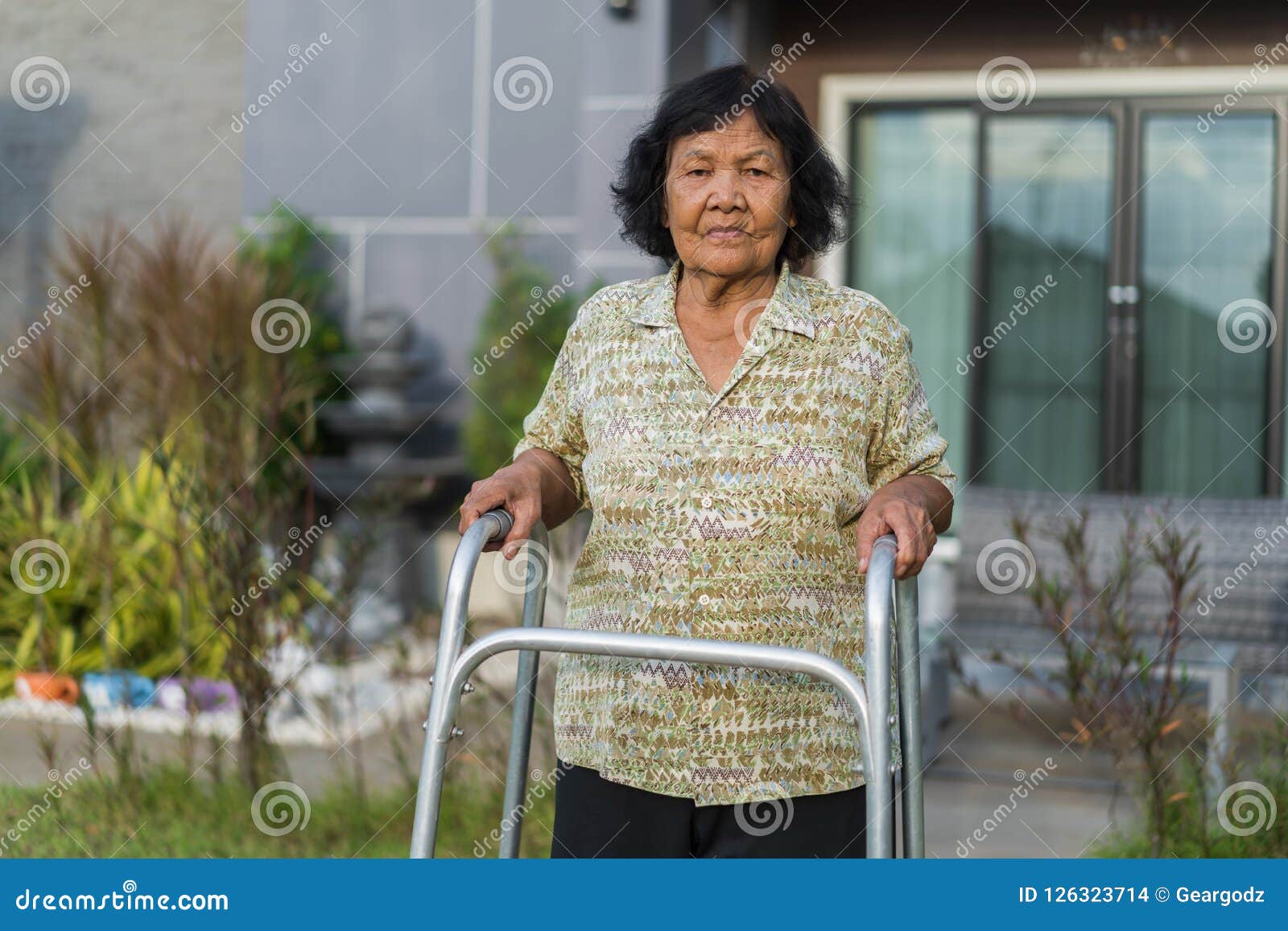 Senior Woman Walking with Walker Stock Photo - Image of portrait ...