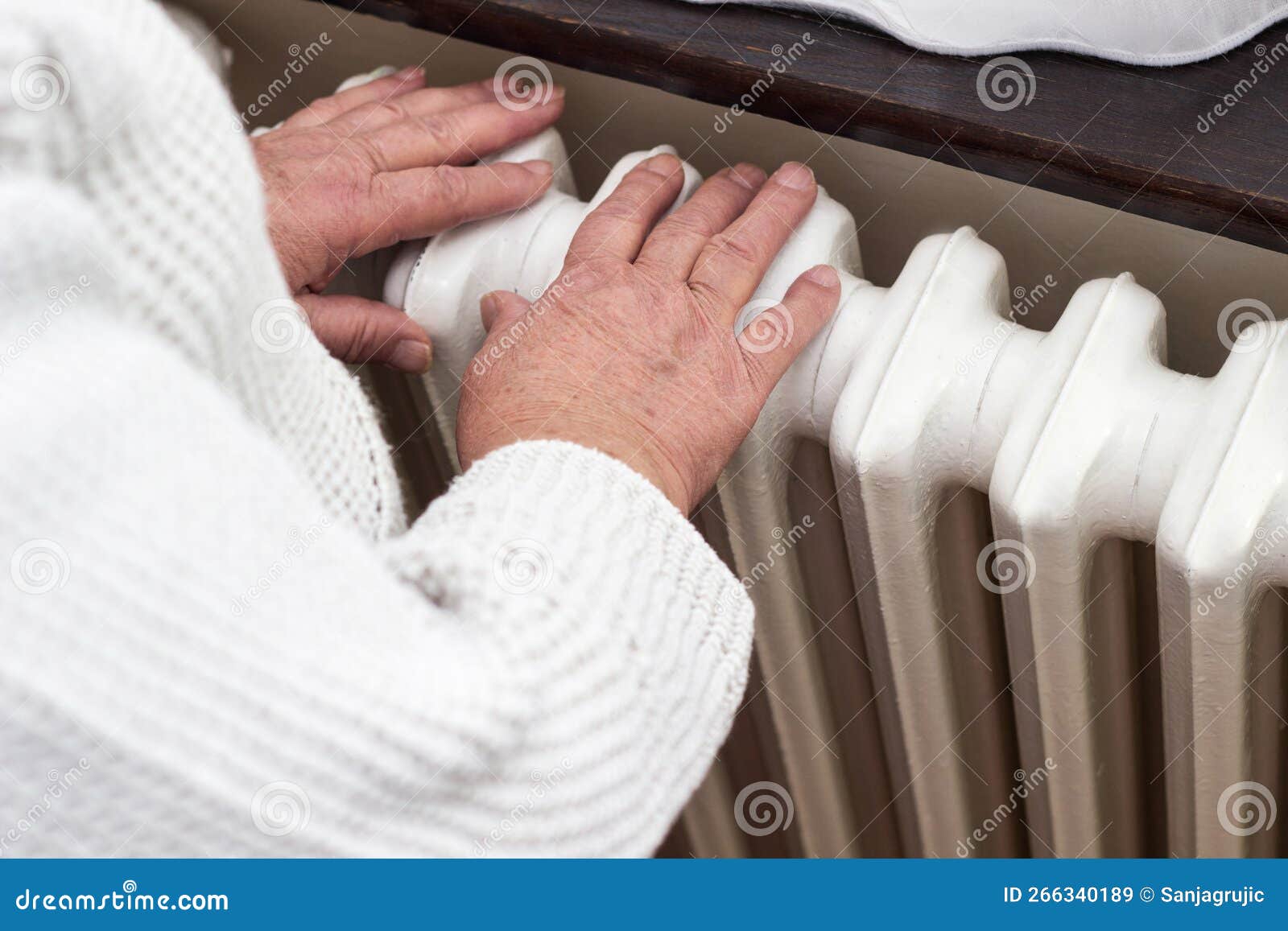 Senior Woman Warming Hands on the Heating Radiator Stock Image - Image ...