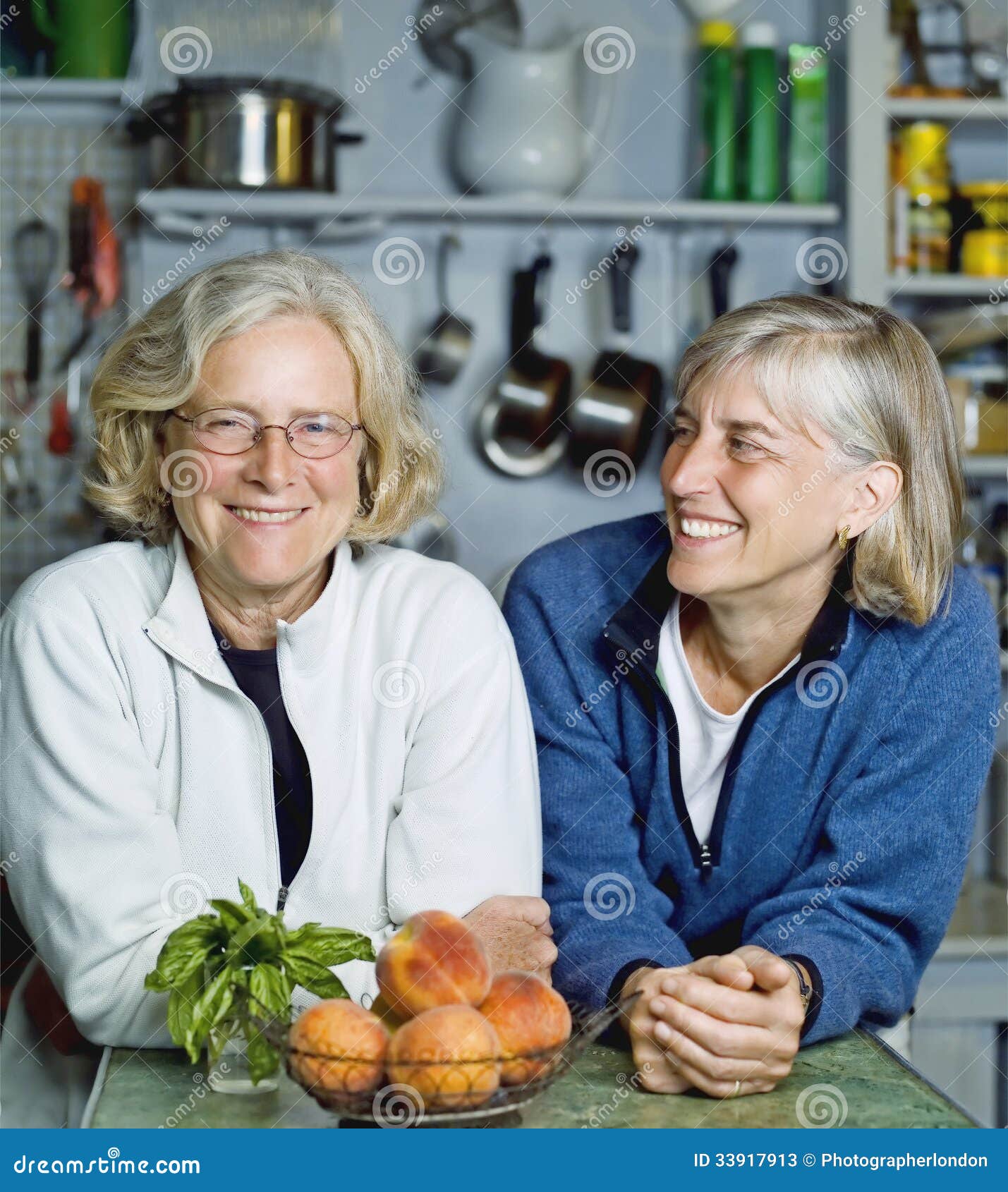 Senior Women Leaning at Kitchen Counter Stock Image - Image of ...