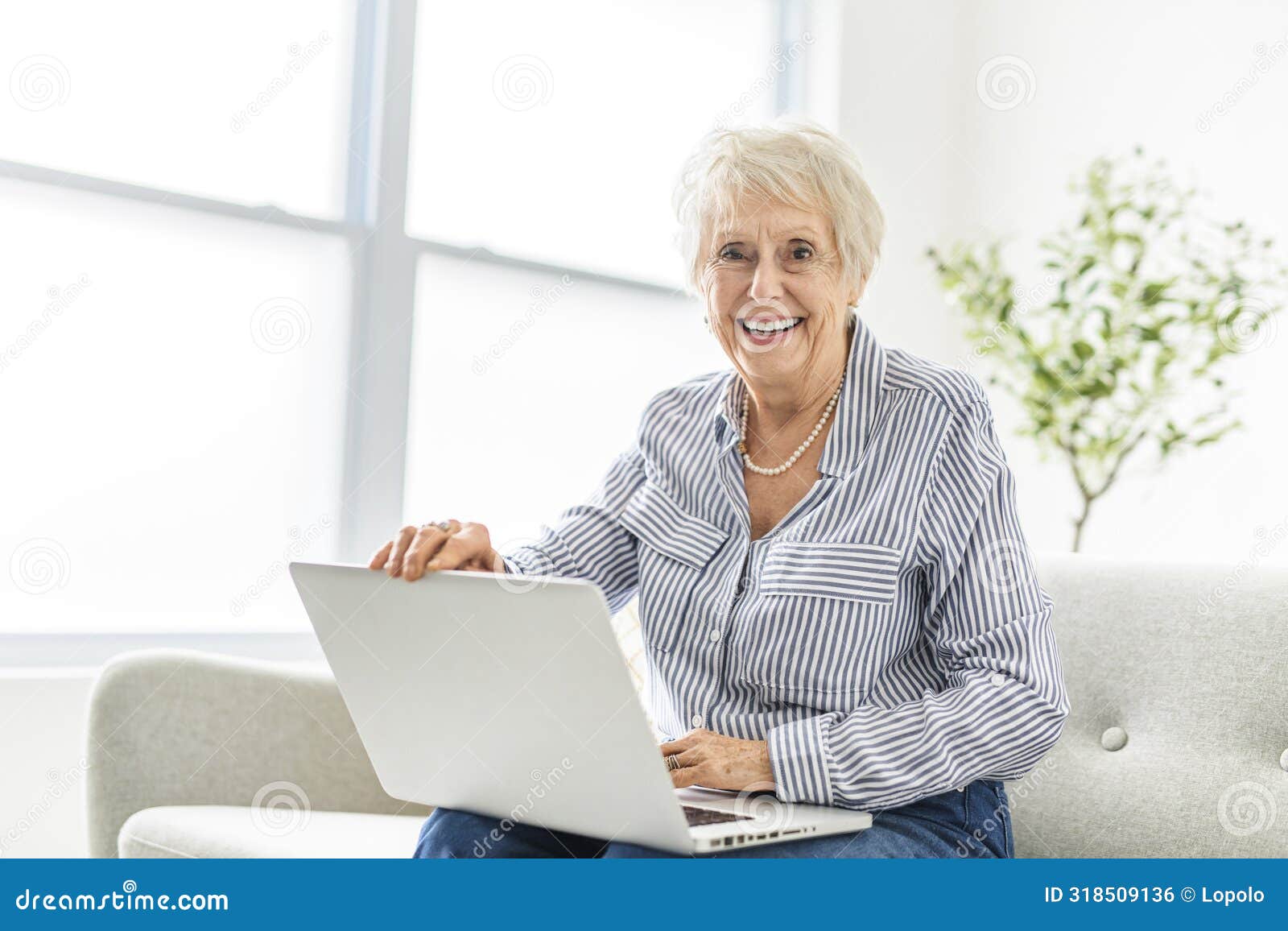 Senior Women Using a Laptop while Sitting at the Office Stock Photo ...