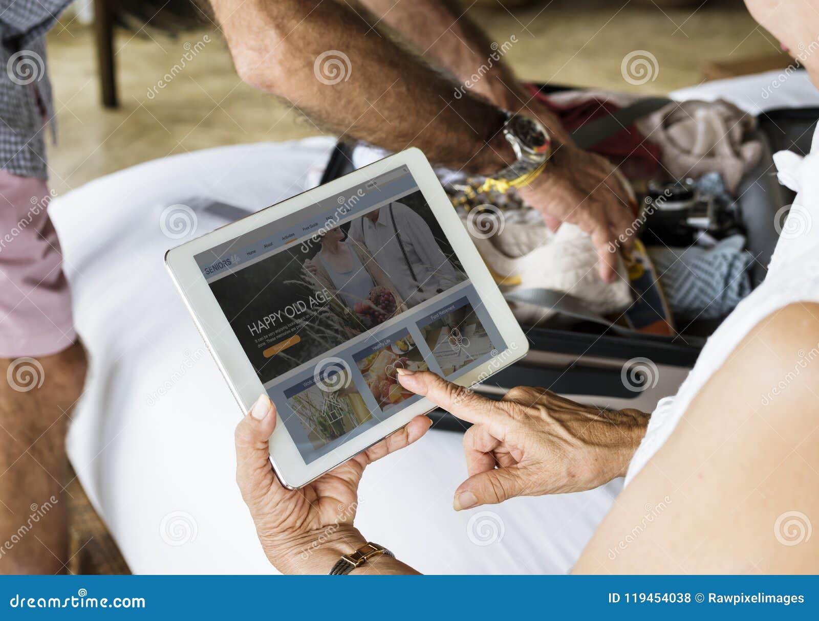 Senior Woman Using a Tablet on the Bed Stock Photo - Image of lifestyle ...