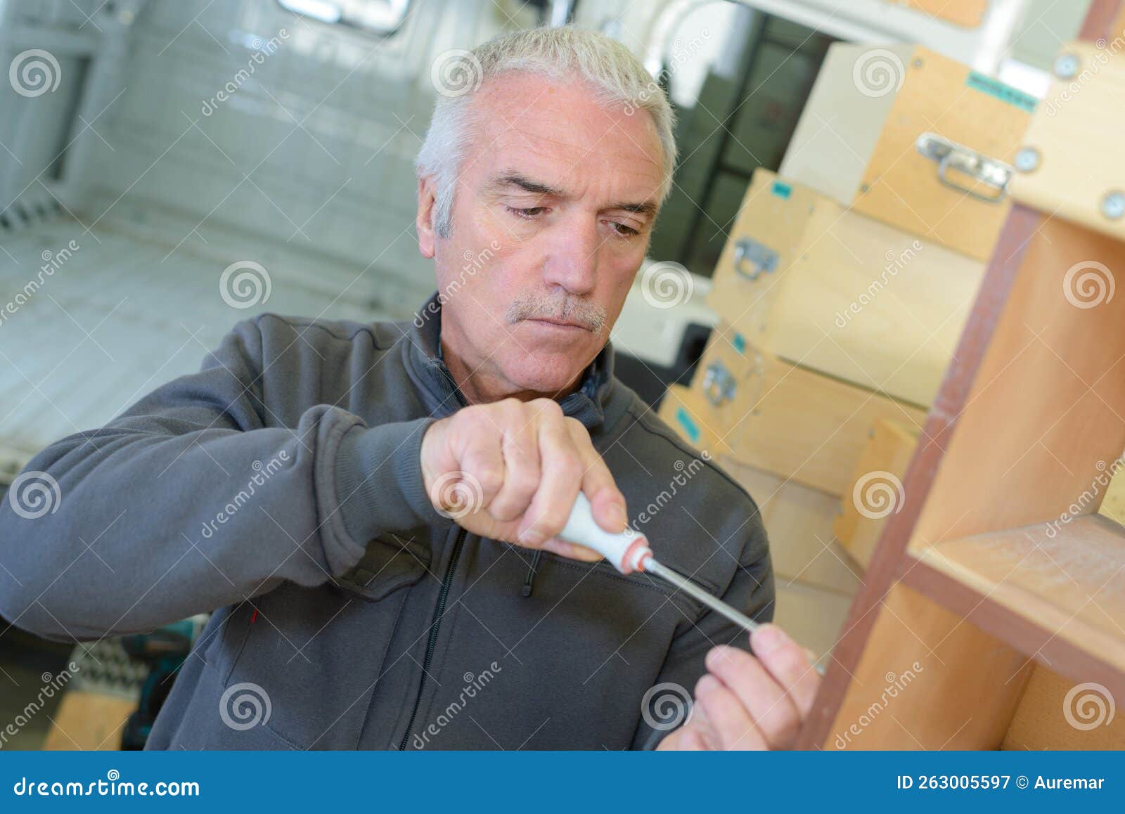 Senior Worker Assembling Cabinet Stock Image - Image of size ...
