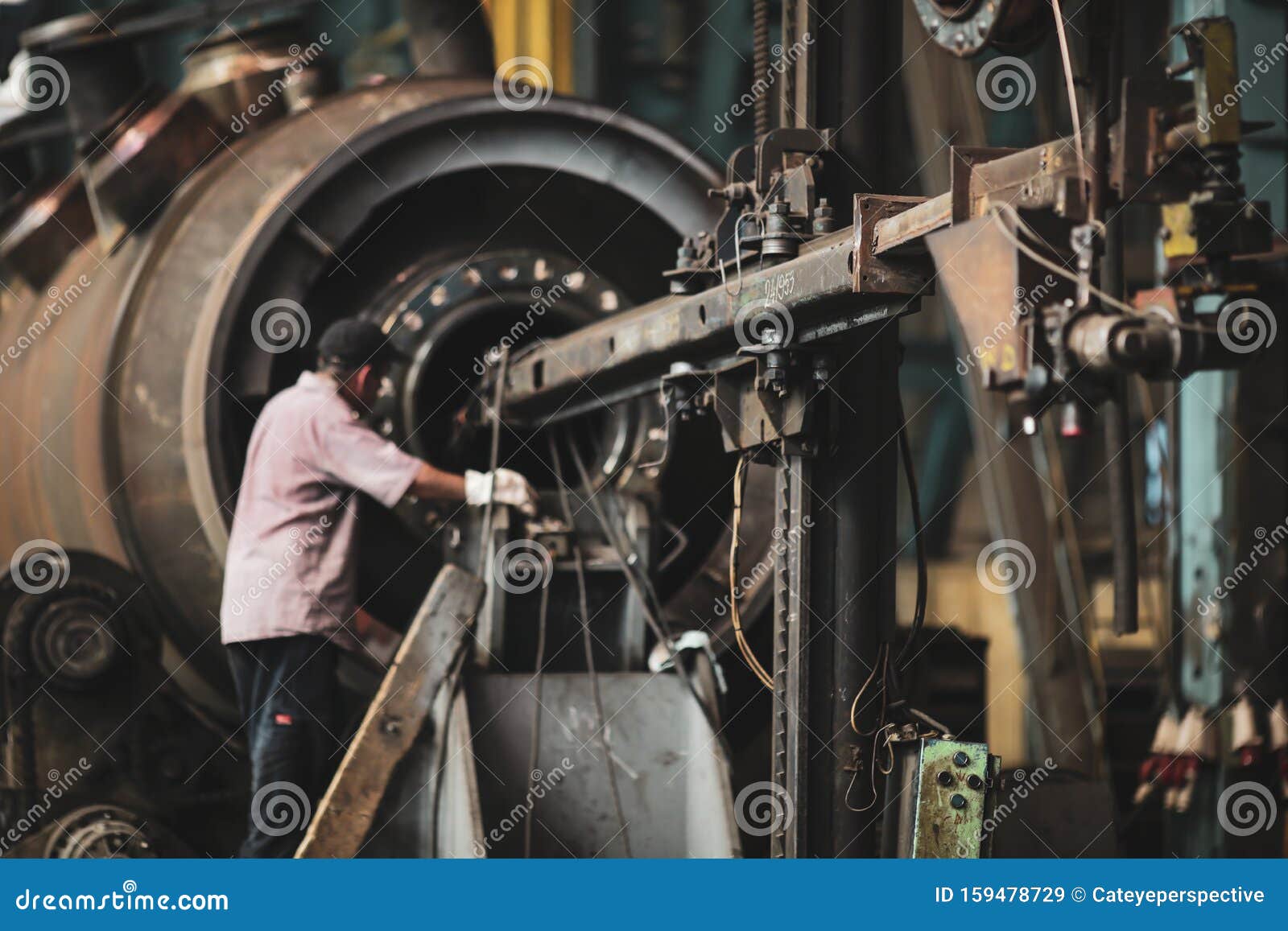 Senior Worker in a Dirty and Old but Still Functioning Metal Works, Old ...