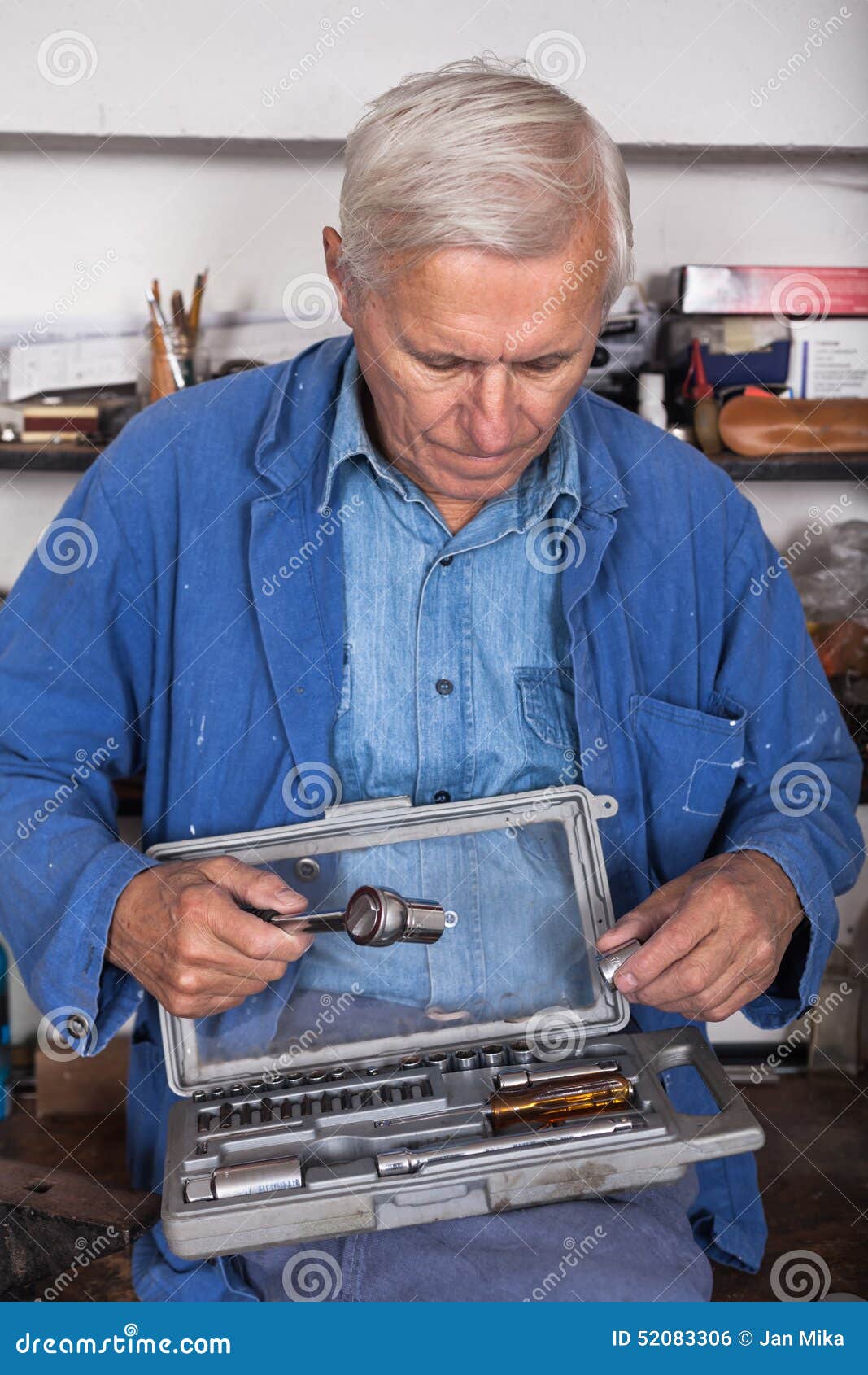 Senior worker with tools stock photo. Image of holding - 52083306