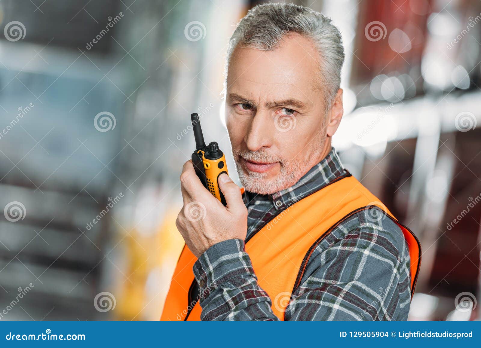 Senior Worker Using Walkie Talkie Stock Photo - Image of person ...