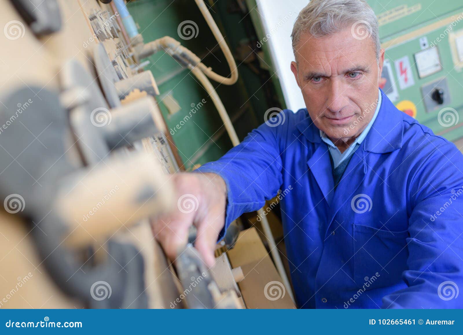 Senior worker in workshop stock image. Image of table - 102665461