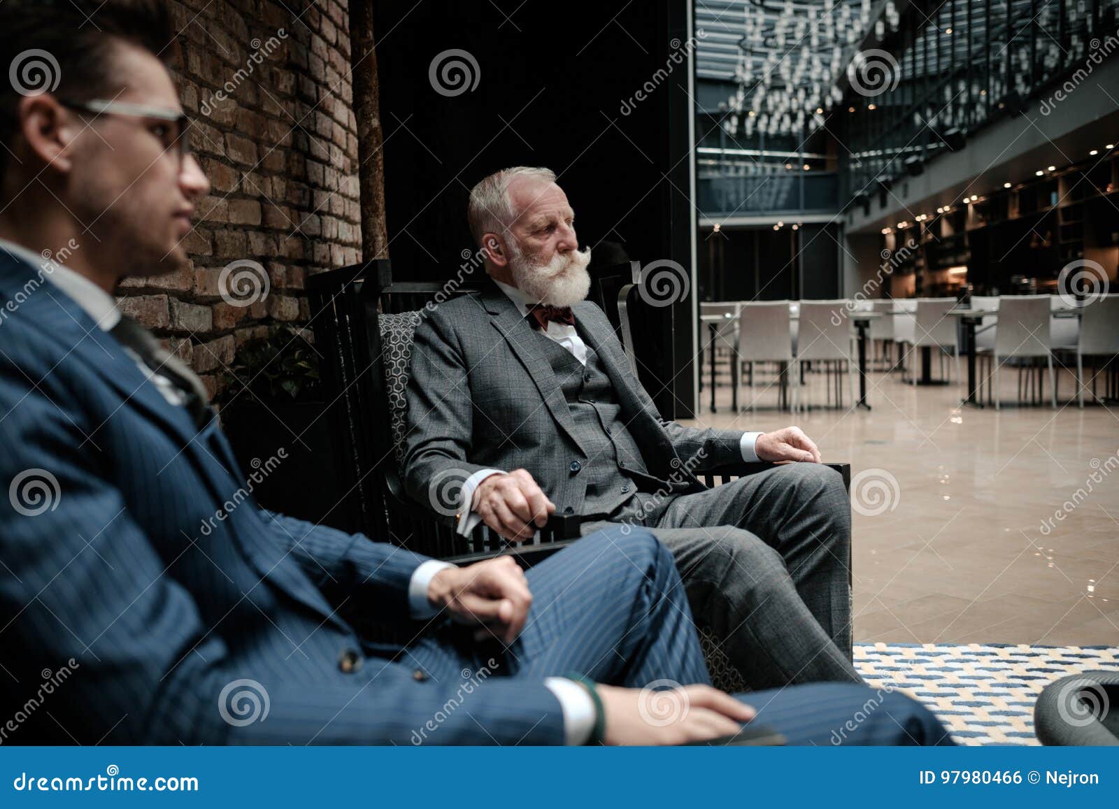 Senior and Young Gentlemen Having Conversation Stock Photo - Image of ...