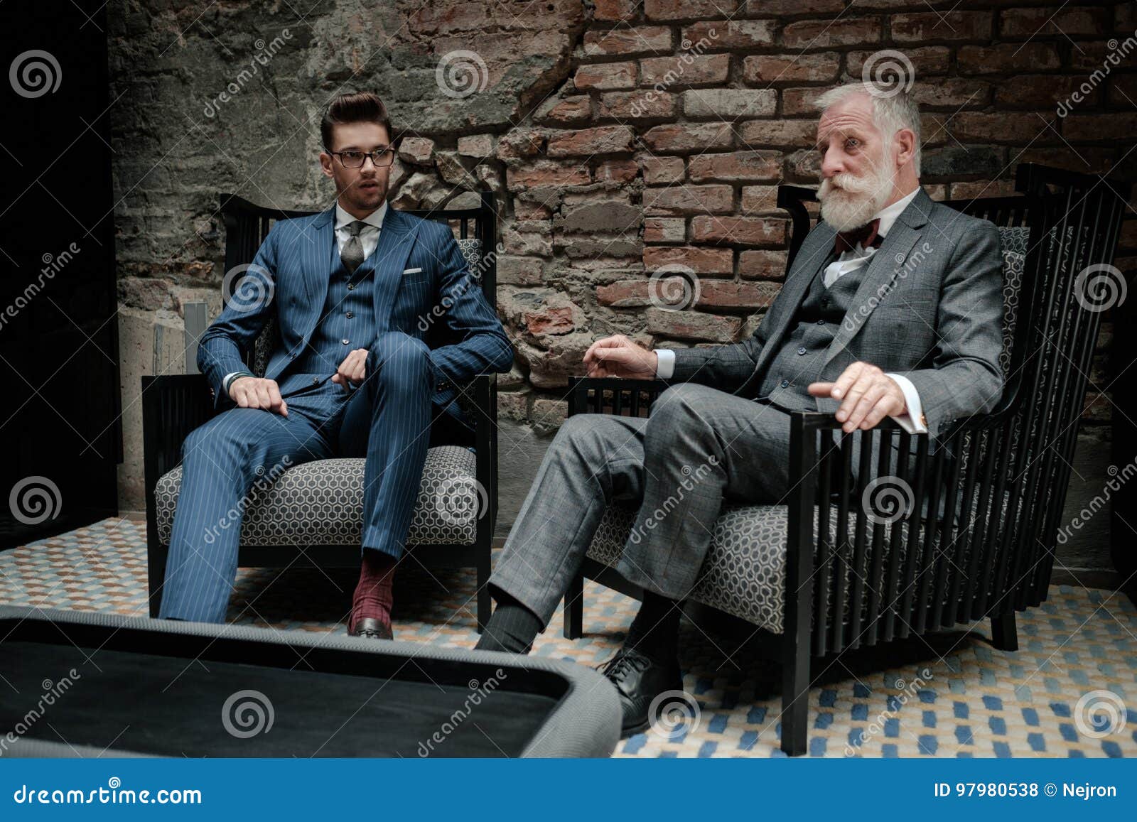 Senior and Young Gentlemen Having Conversation Stock Photo - Image of ...