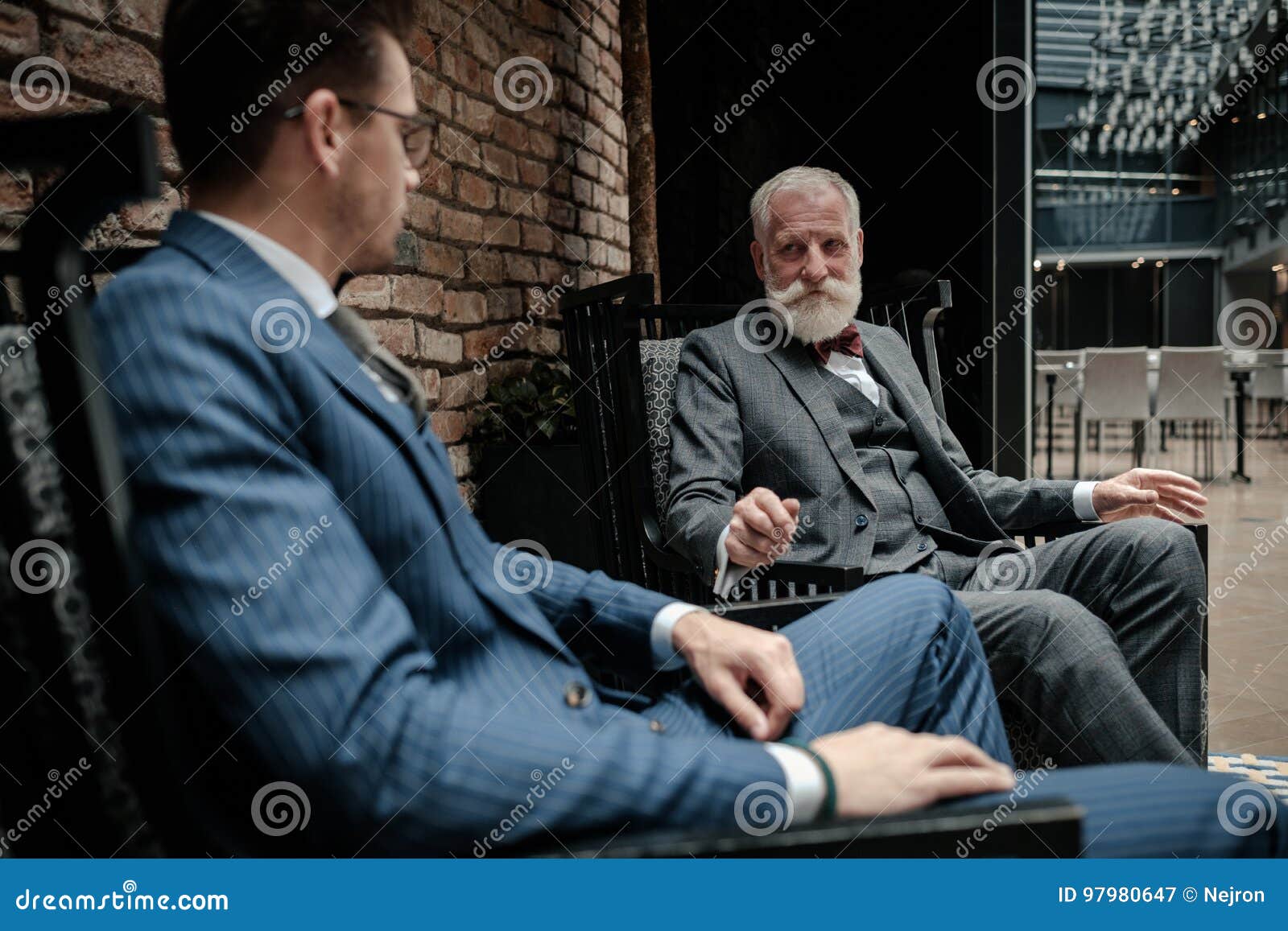 Senior and Young Gentlemen Having Conversation Stock Image - Image of ...
