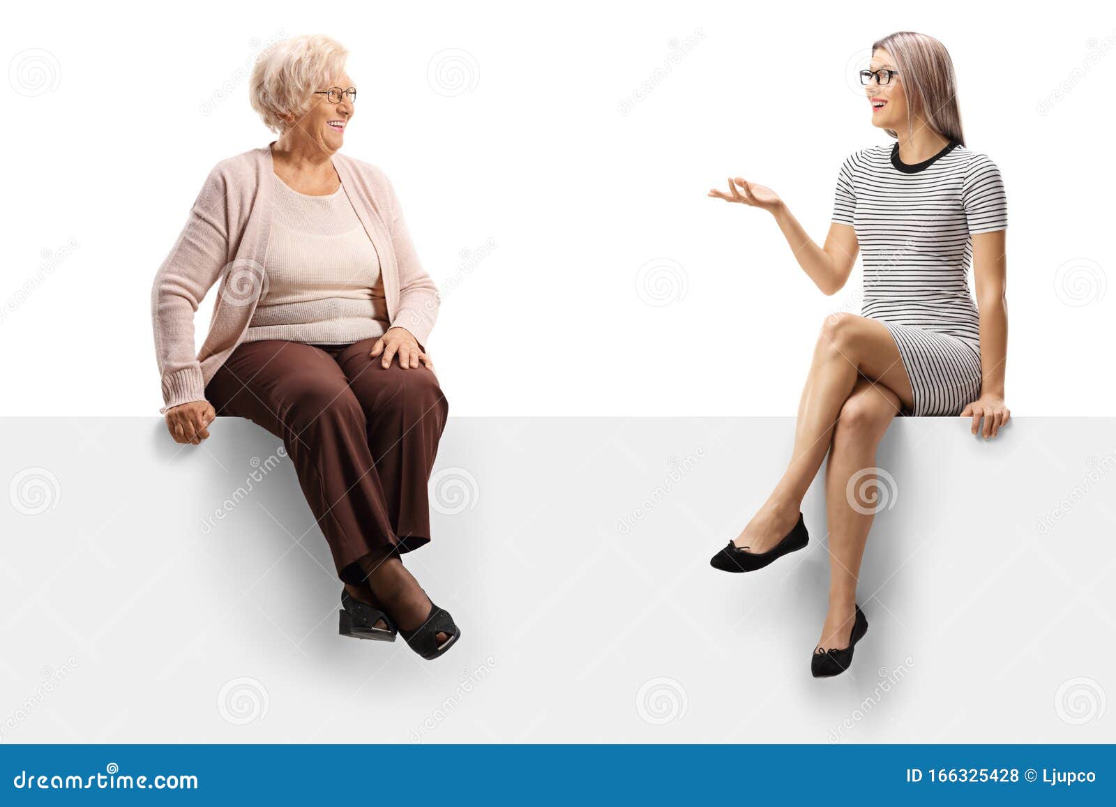 Senior and Young Woman Sitting on a Panel and Having a Conversation ...