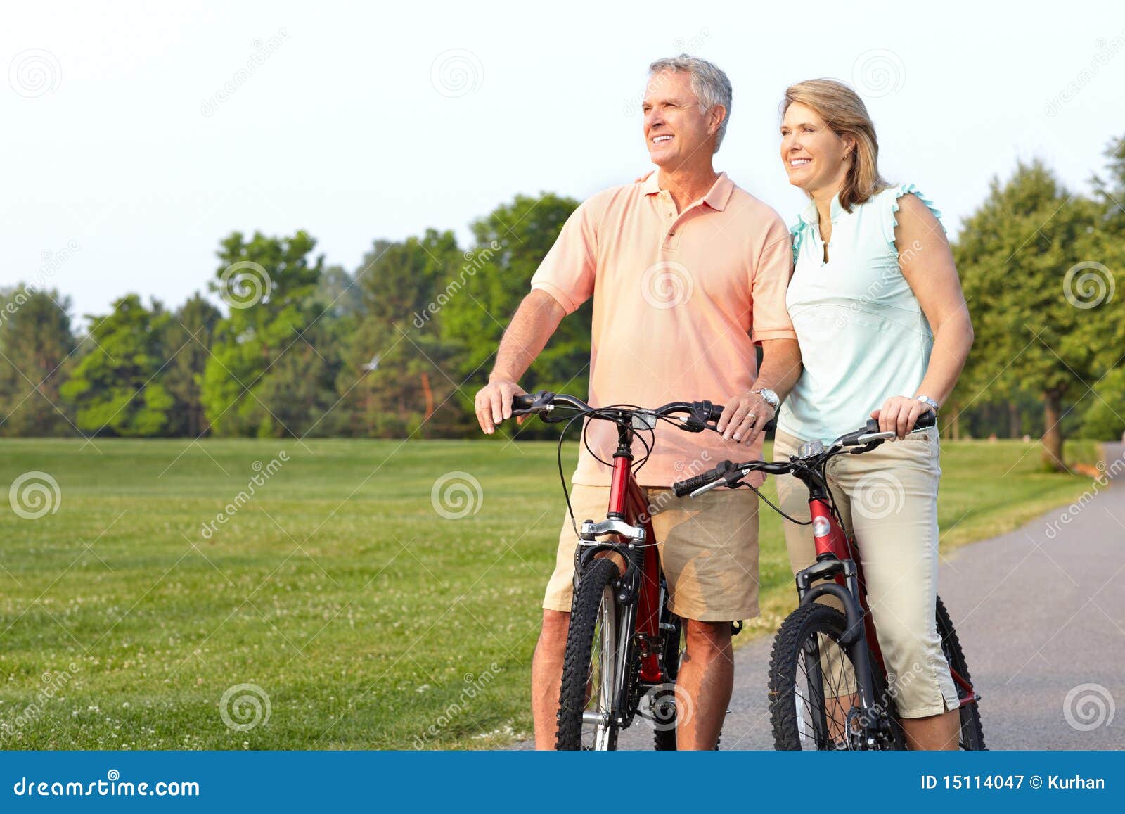 Seniors couple biking stock image. Image of portrait - 15114047