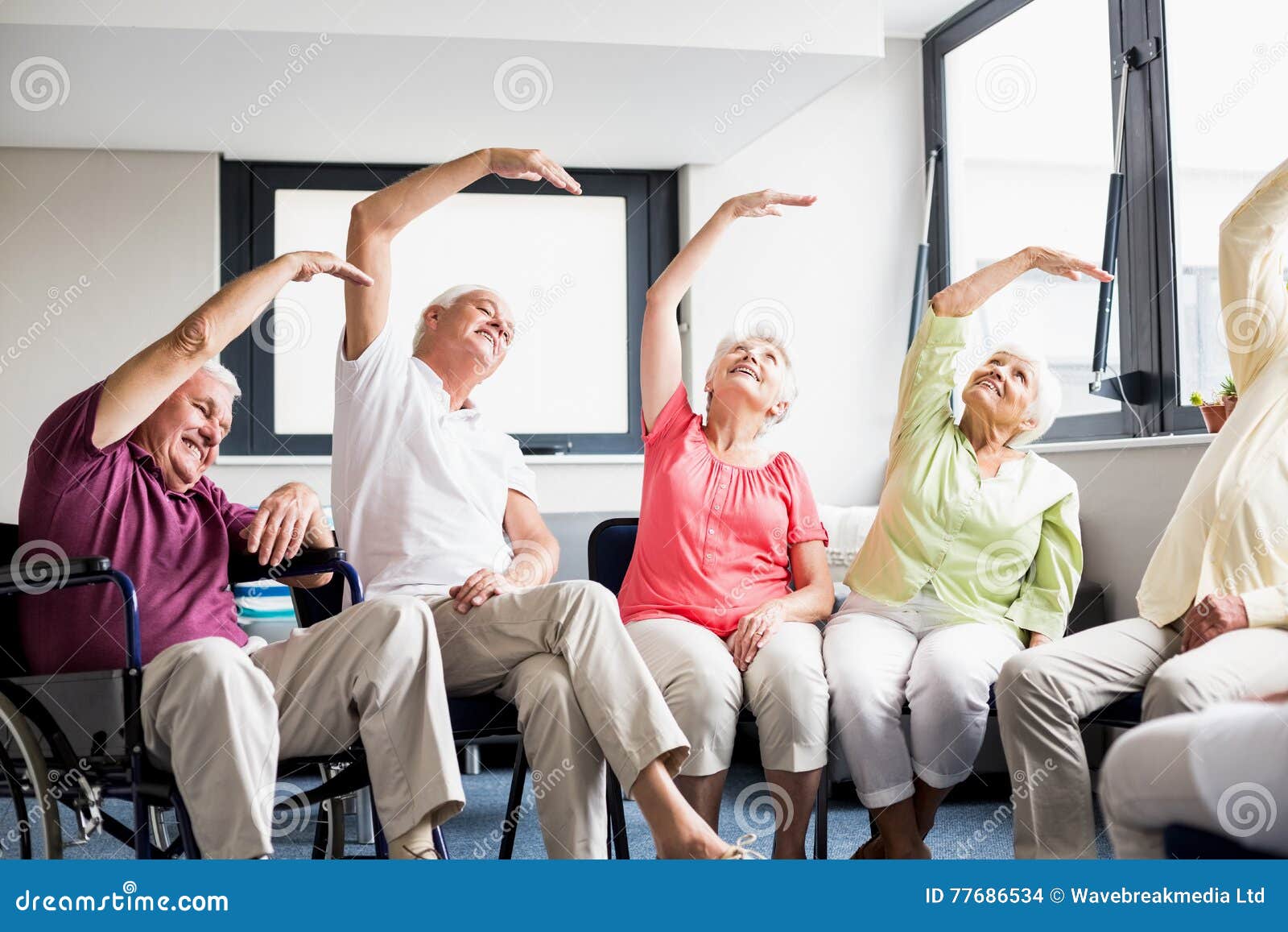 Seniors doing exercises stock photo. Image of chairs - 77686534