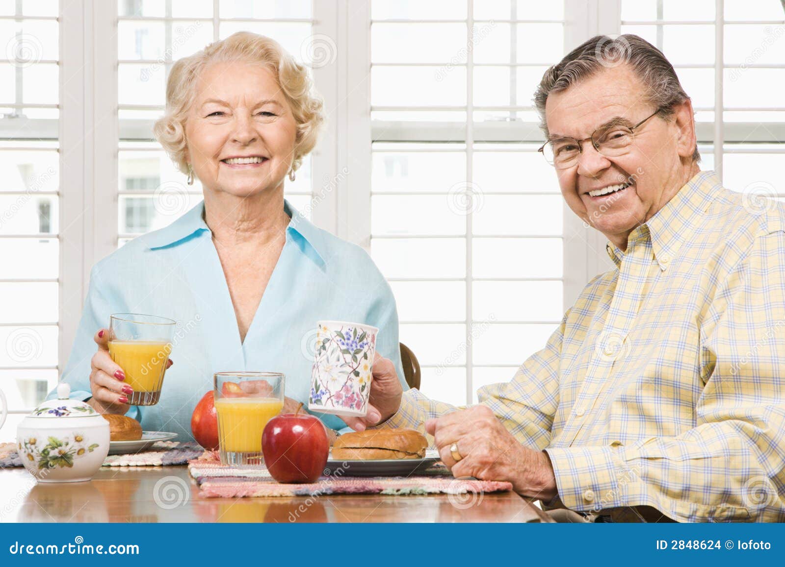 Seniors eating breakfast stock photo. Image of indoors - 2848624