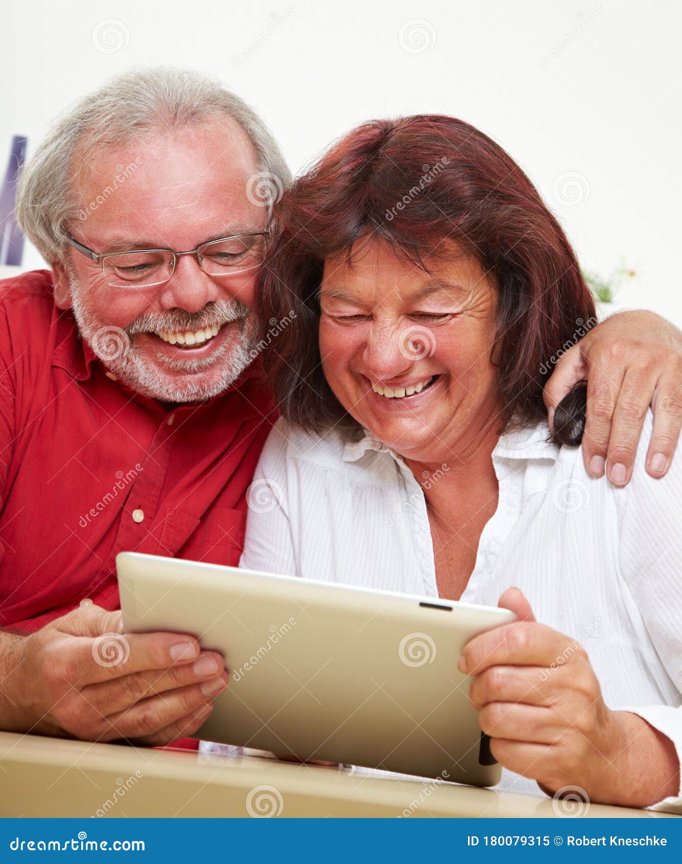 Seniors Look at Tablet Computers Together Stock Image - Image of hold ...