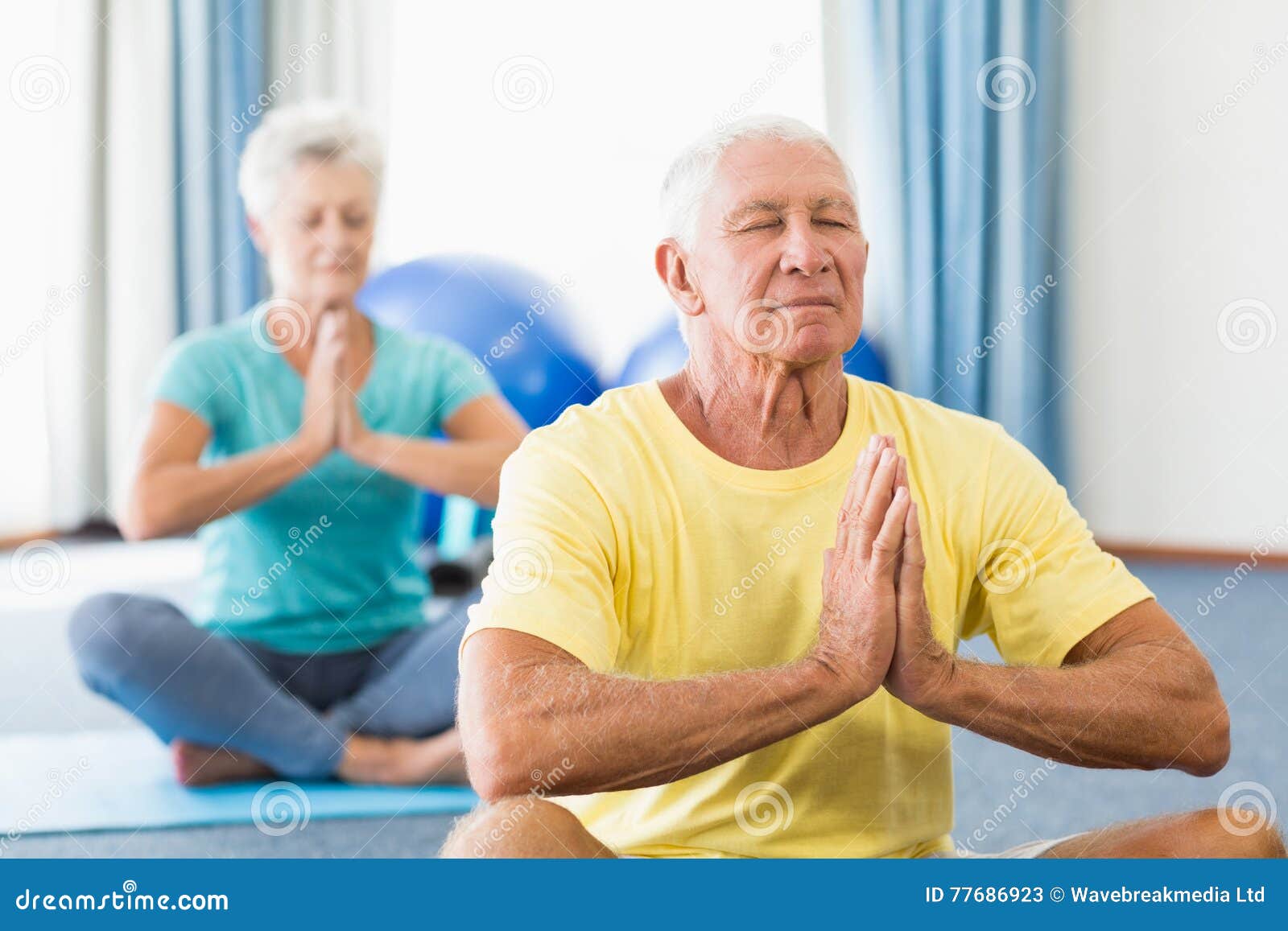 Seniors performing yoga stock image. Image of medicare - 77686923