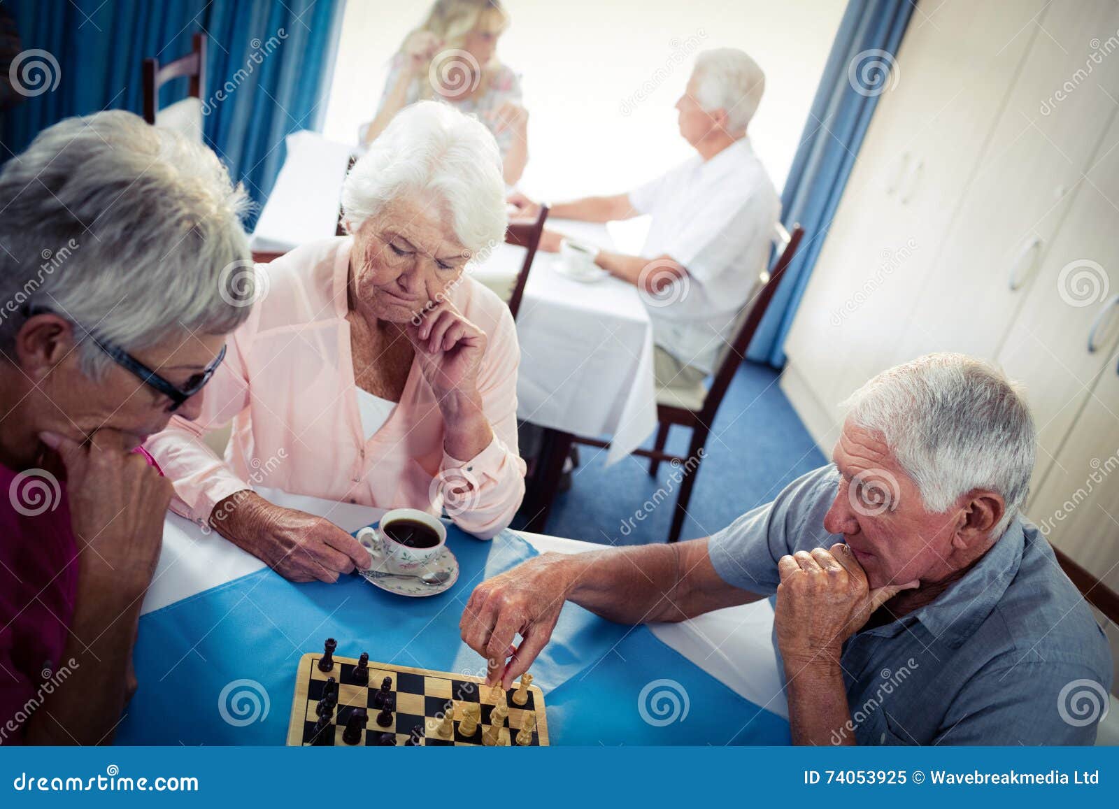 Seniors playing chess stock image. Image of geriatric - 74053925