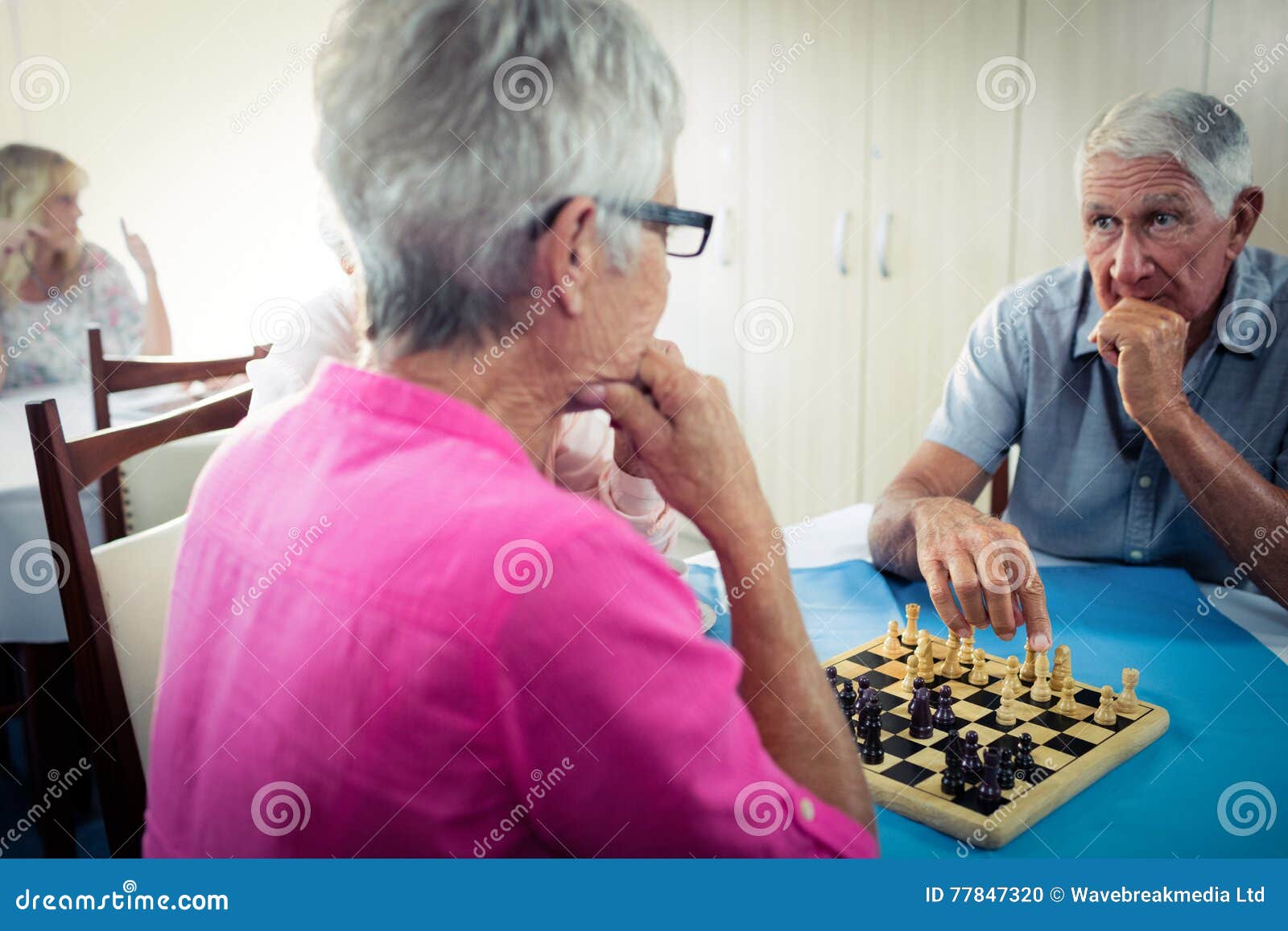 Seniors playing chess stock photo. Image of helping, concept - 77847320