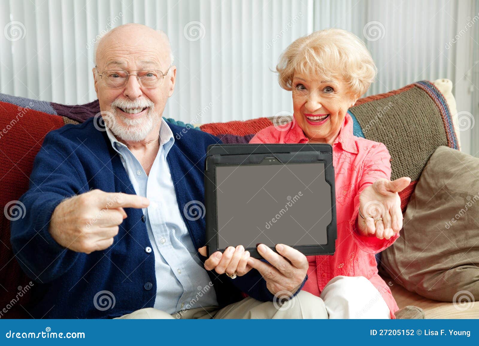 Seniors Point to Tablet PC stock photo. Image of adult - 27205152