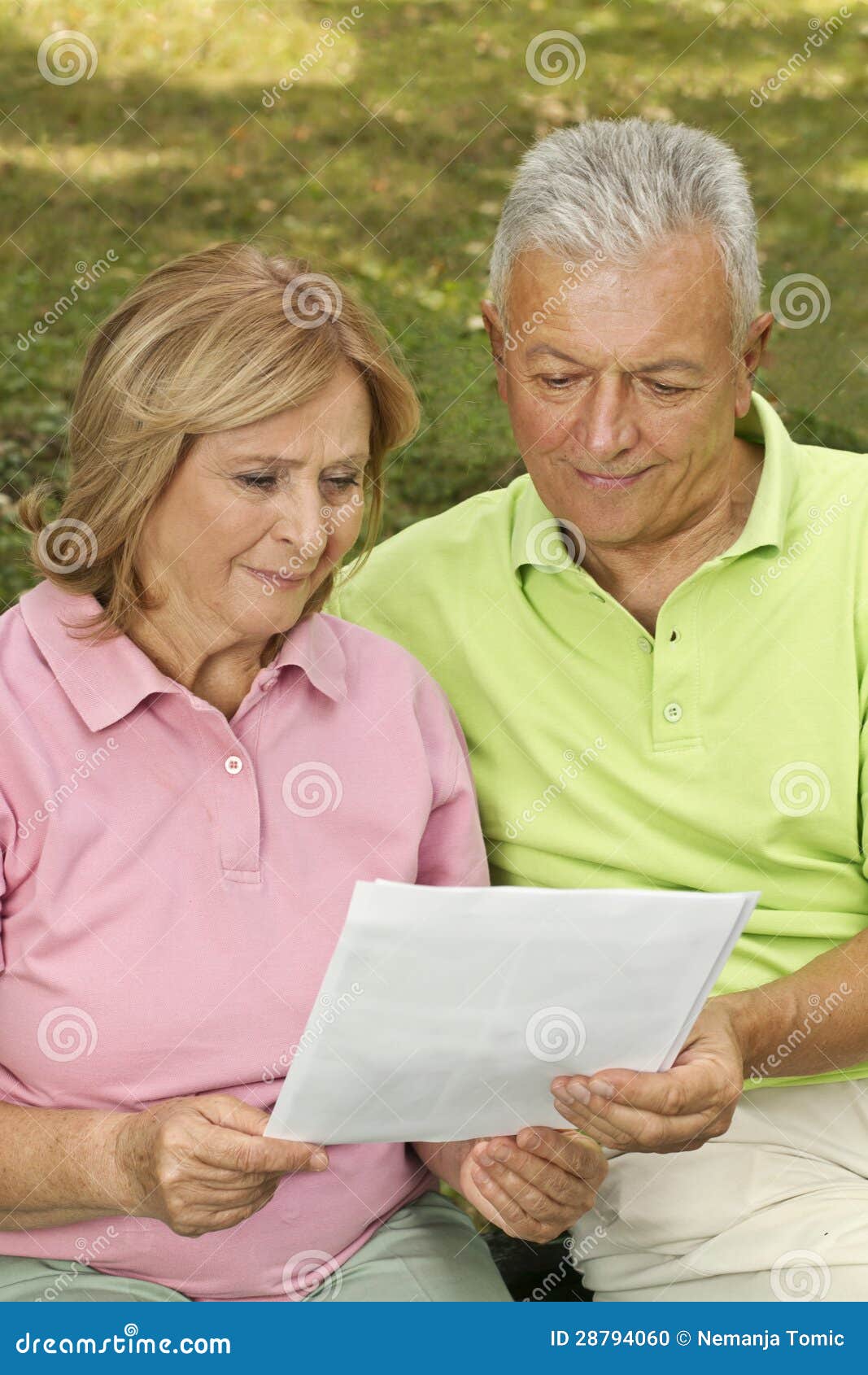 Seniors read paper stock photo. Image of woman, paper - 28794060
