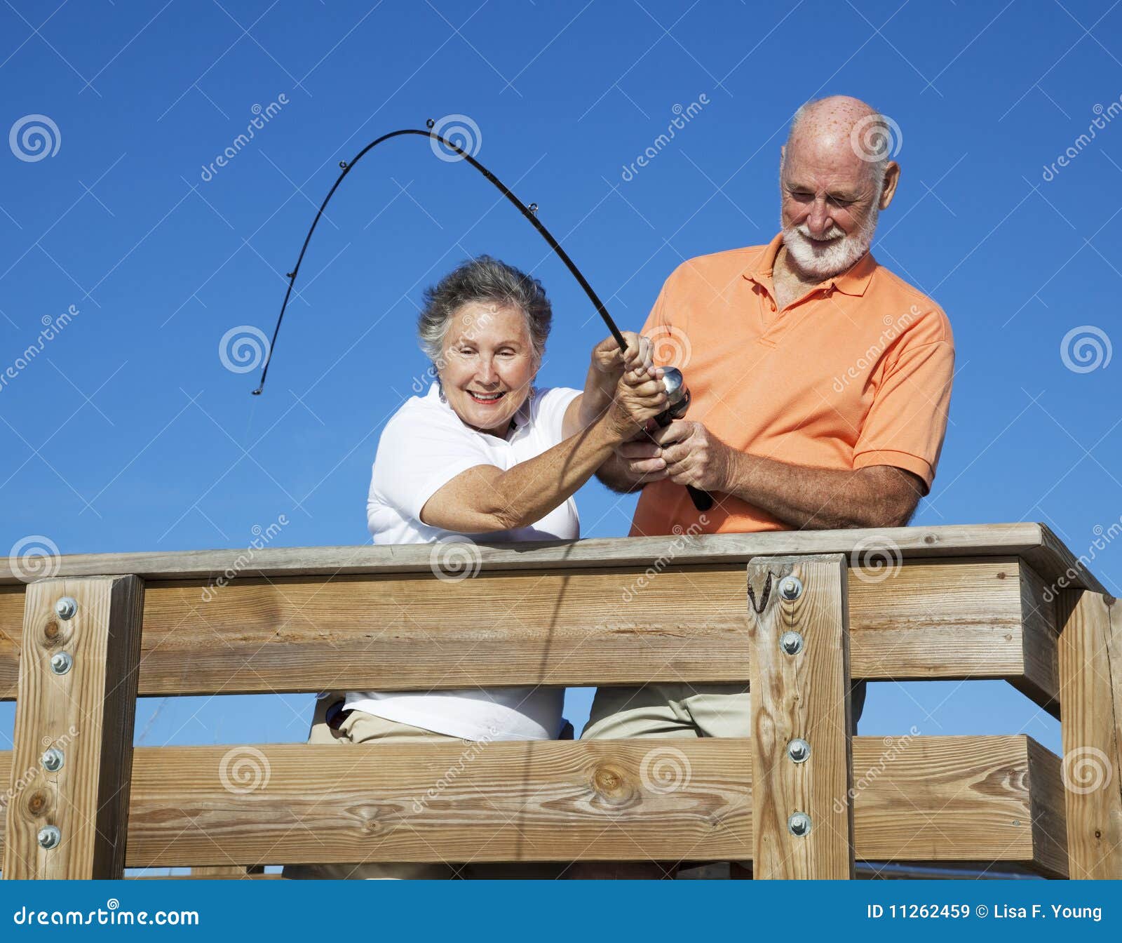 Seniors Reeling in a Big Fish Stock Image - Image of help, people: 11262459