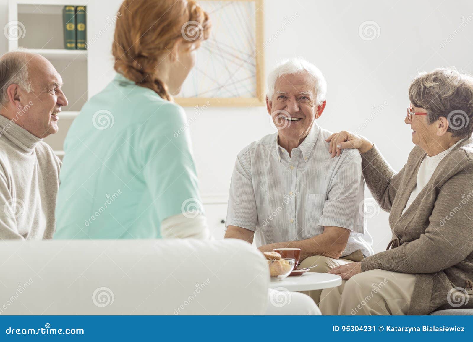 Seniors sitting with nurse stock image. Image of minimal - 95304231