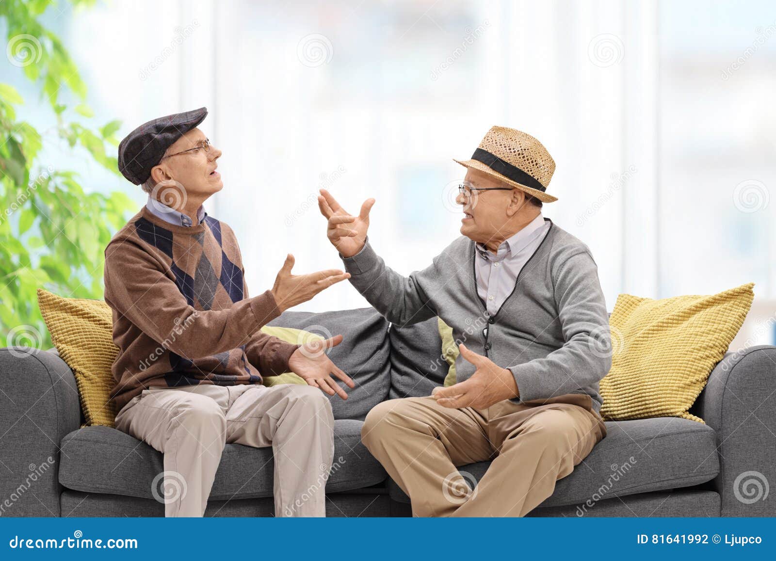 Seniors Sitting on a Sofa and Arguing Stock Photo - Image of pillow ...