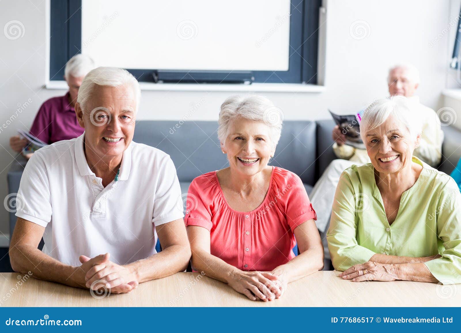 Seniors sitting at a table stock image. Image of five - 77686517