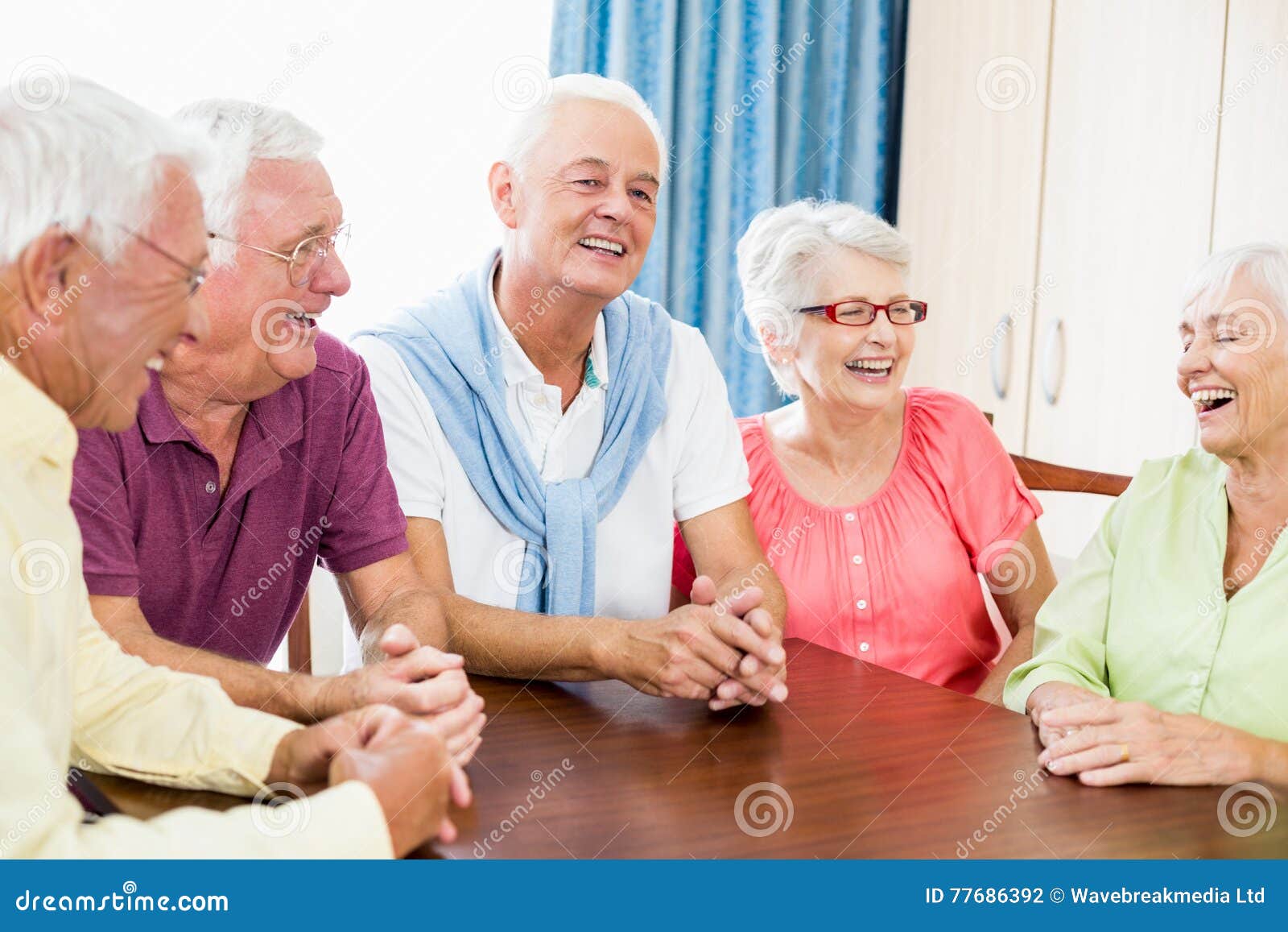 Seniors talking at table stock photo. Image of leisure - 77686392