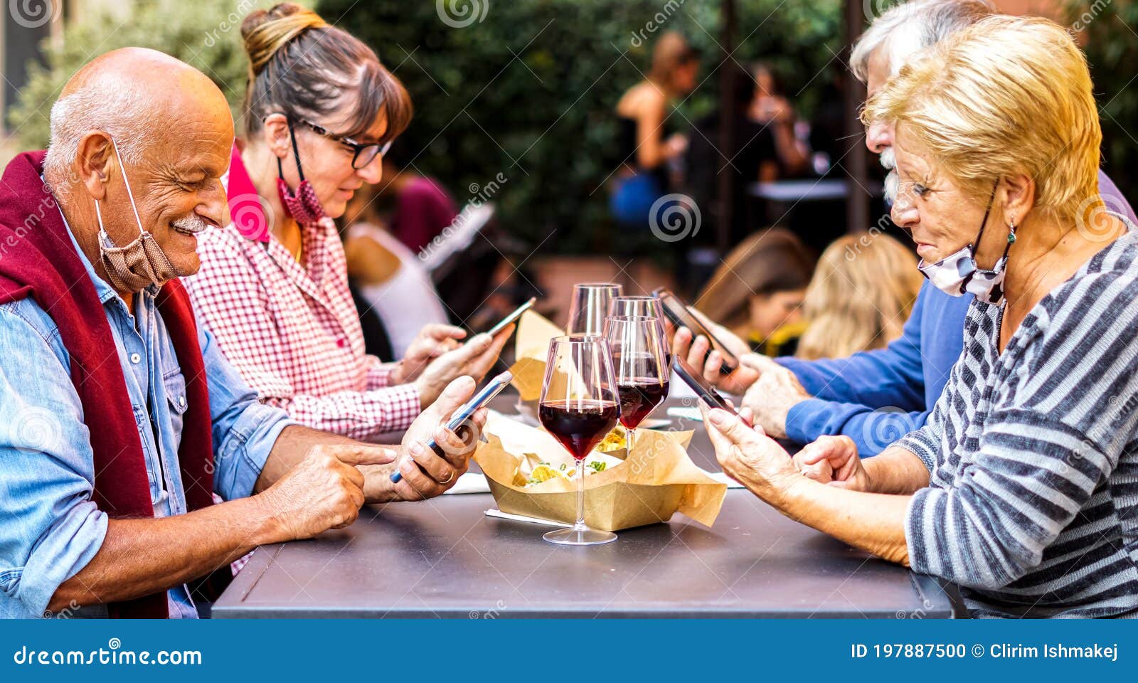 Seniors Using Smartphone Outside Stock Photo - Image of couples, mobile ...