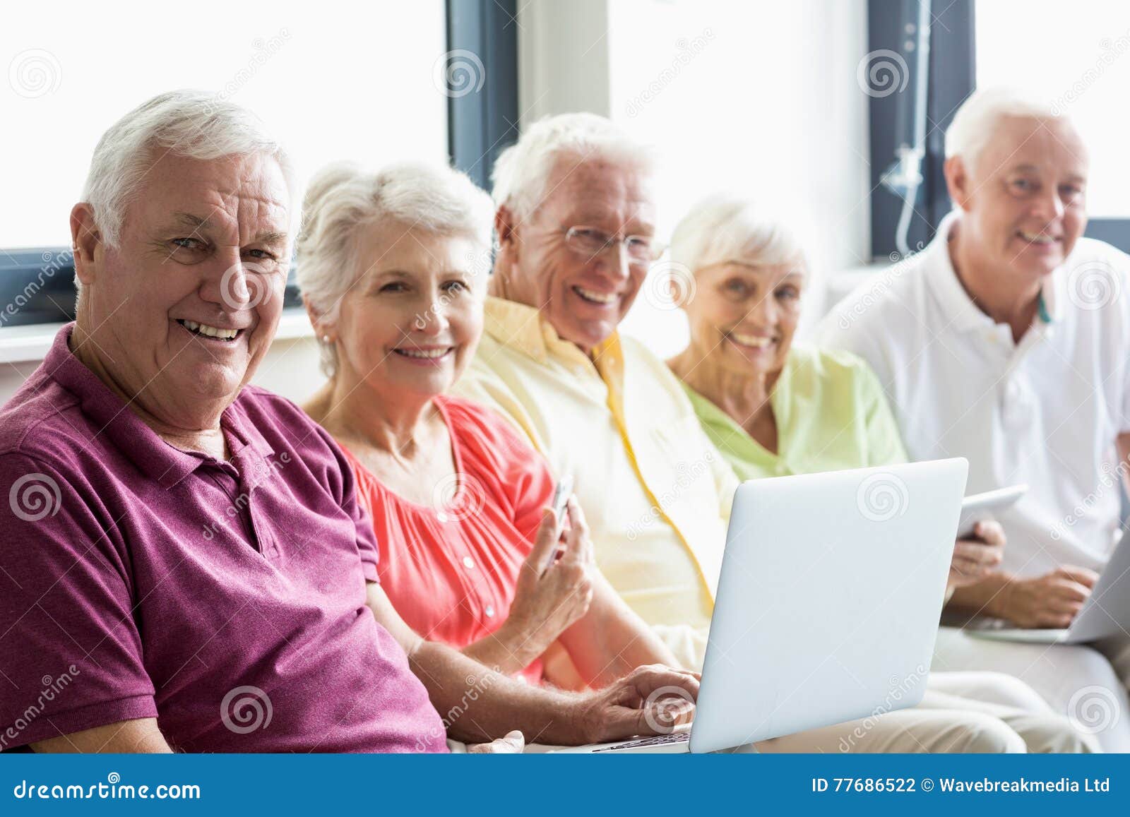 Seniors using technology stock photo. Image of couch - 77686522