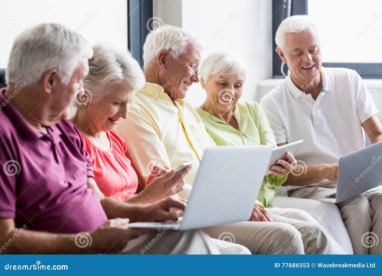 Seniors using technology stock image. Image of mature - 77686553