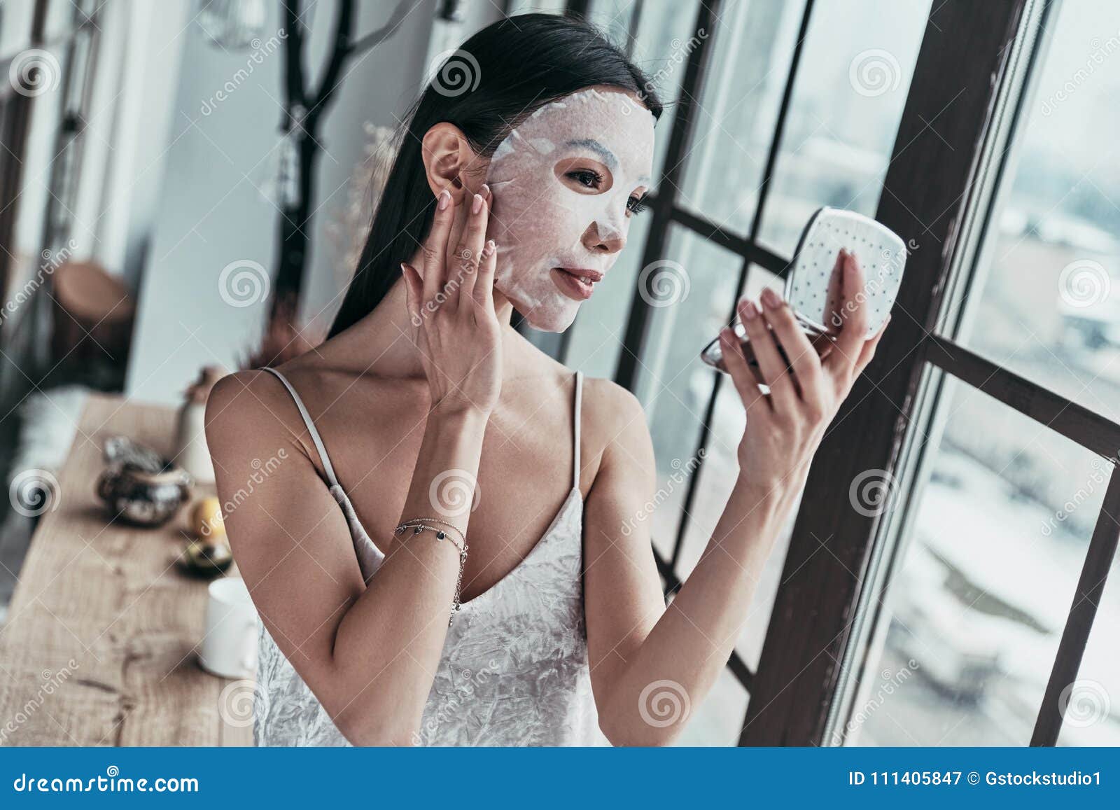 Sensitive Care For A Luminous Skin Attractive Young Woman Apply Stock