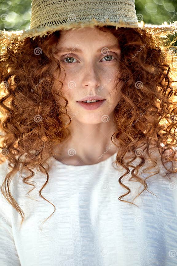 Sensual Caucasian Redhead Female With Curly Wavy Hair Posing Looking