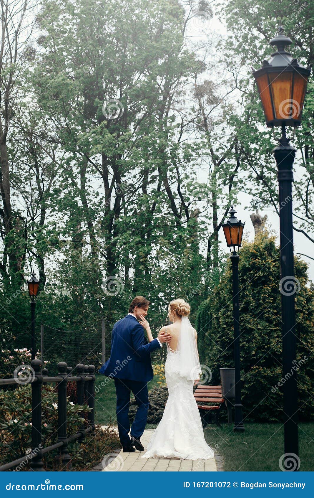 Sensual Newlywed Couple On A Walk In A Park Handsome Groom Touching