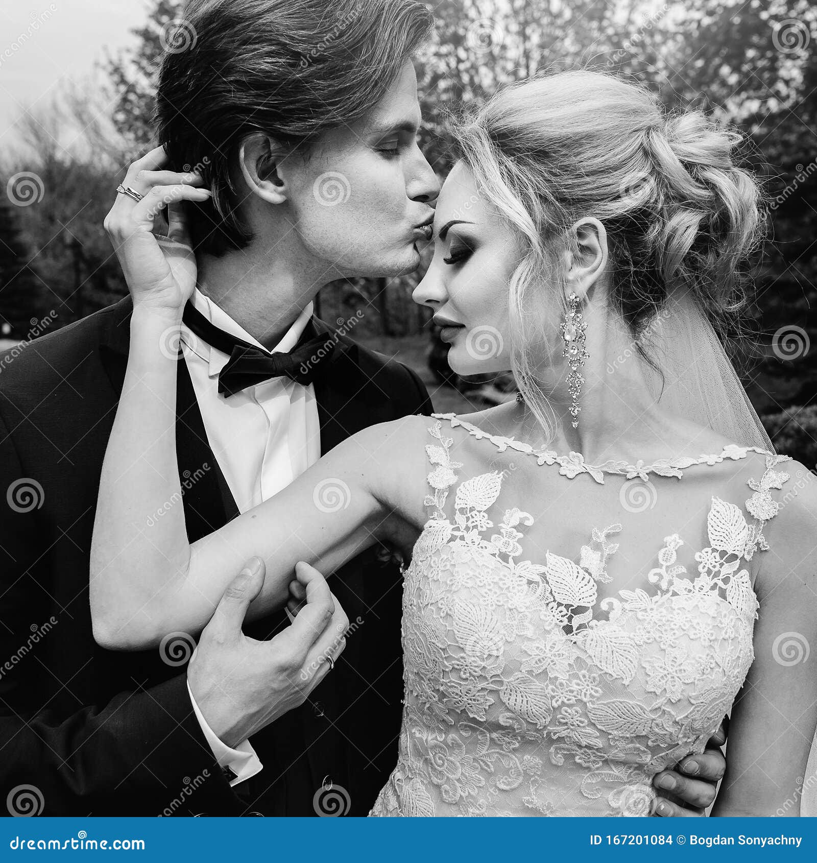 Sensual Newlywed Couple On A Walk In A Park Handsome Groom Touching