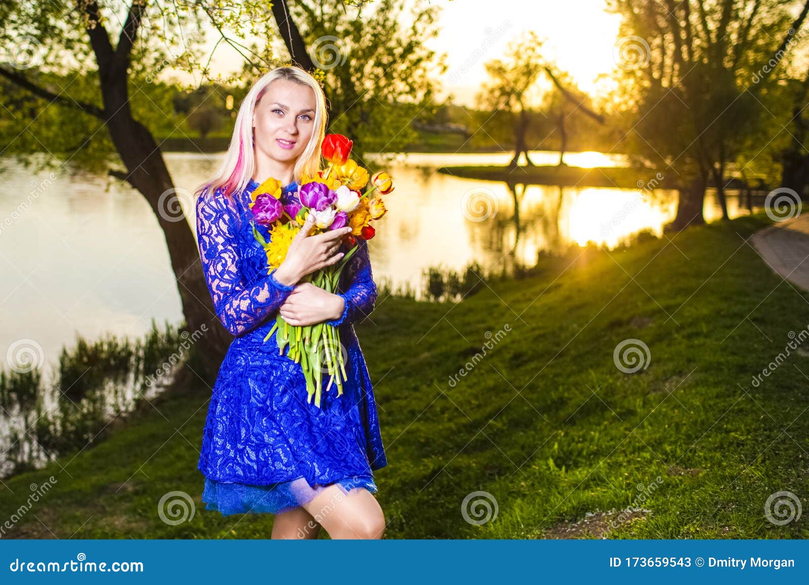 Sensual Romantic Caucasian Blond Girl With Bunch Of Tulips Posing