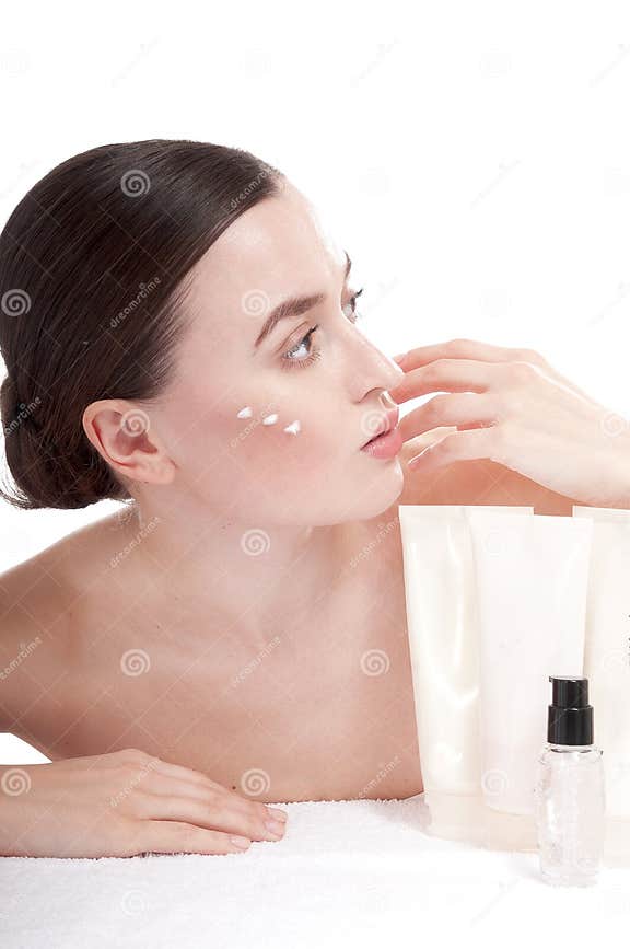 Sensual Woman Applying Cosmetic Cream Treatment On Her Face Stock