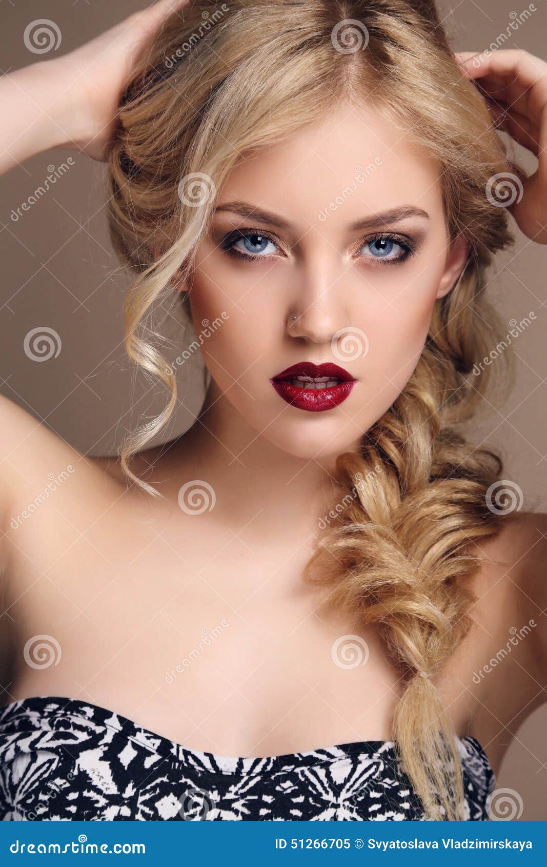 Sensual Woman With Blond Curly Hair With Bright Makeup Stock Image