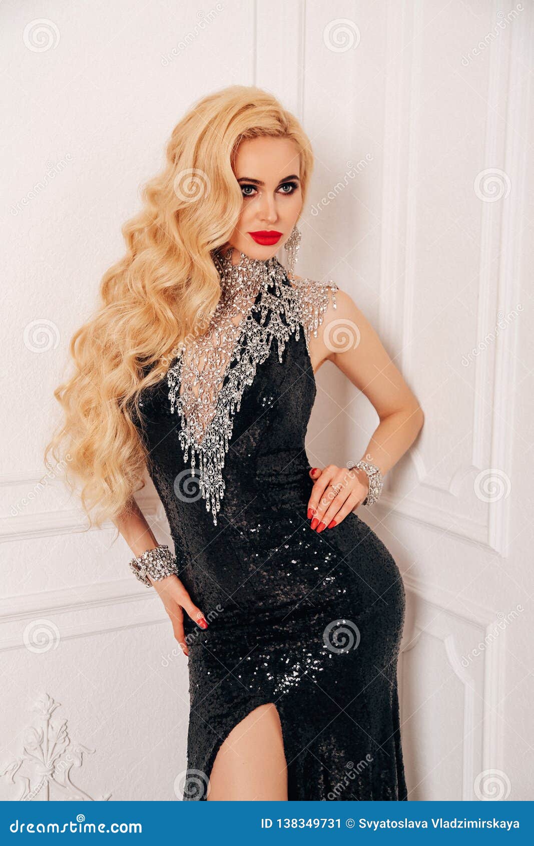 Sensual Woman With Long Blond Hair In Luxurious Evening Dress Stock