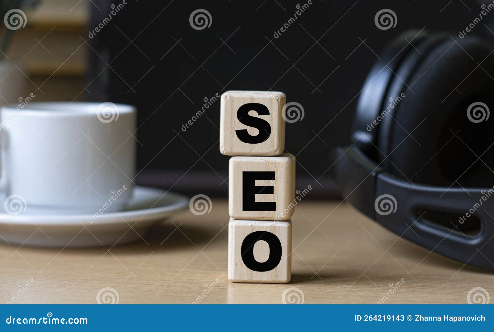 SEO -word on Cubes on the Background of the Tablet, Headphones and a ...