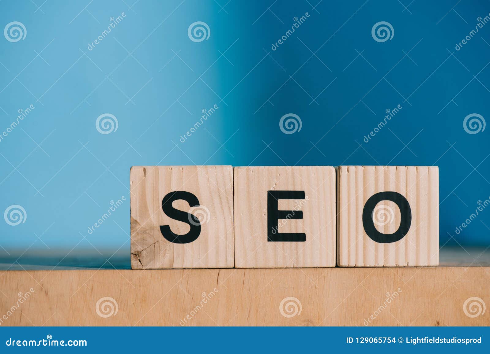 SEO Word Made from Wooden Blocks on Blue Background Stock Photo - Image ...