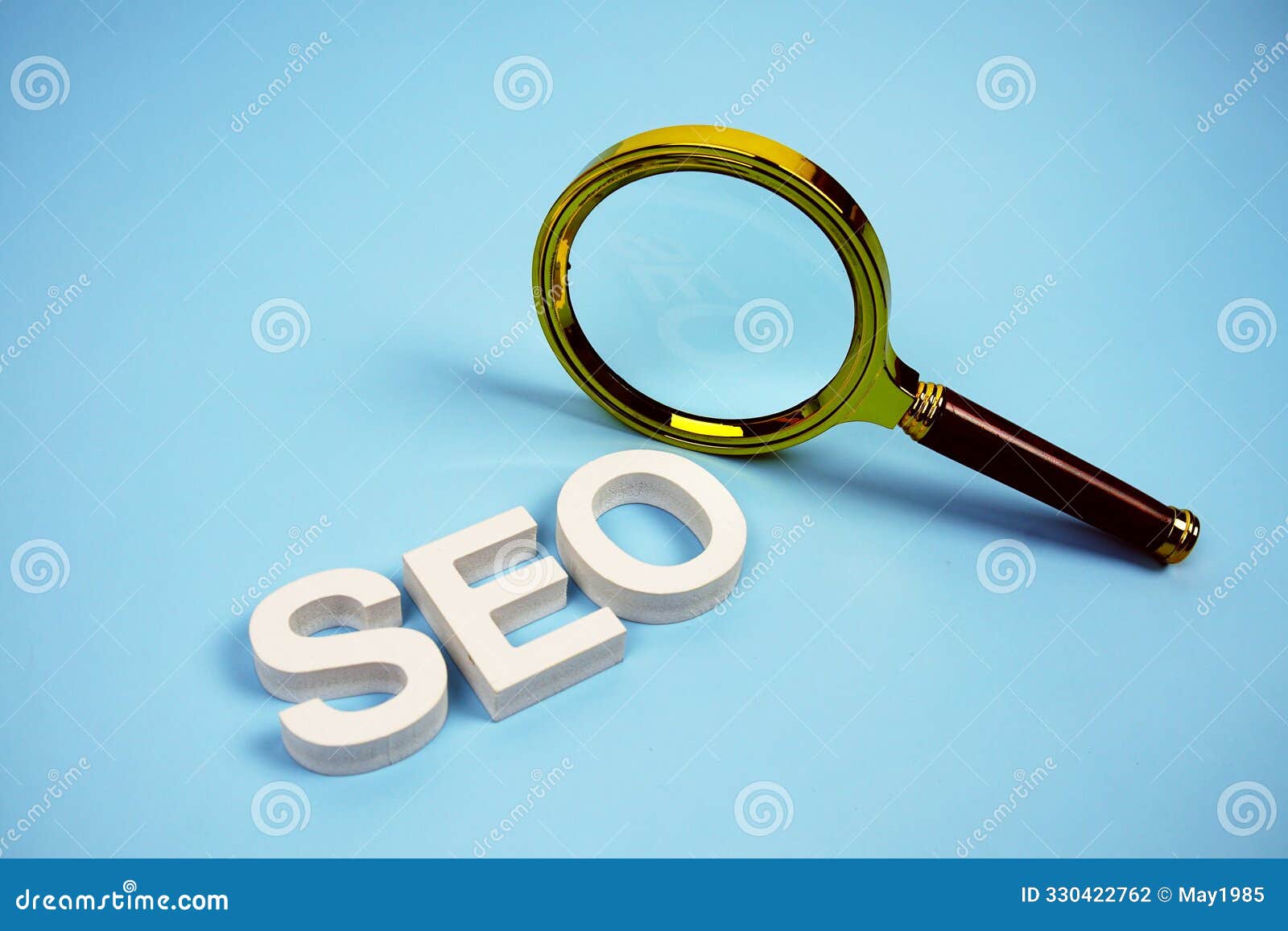 SEO Word with Magnifying Glass Top View on Blue Background Stock Photo ...